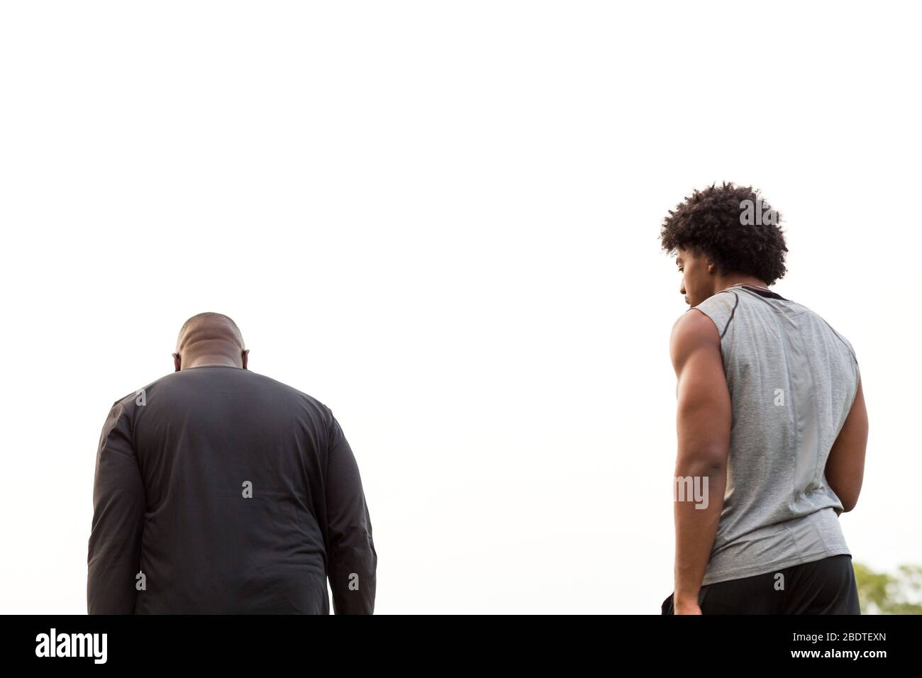 American Football coach training a young athlete Stock Photo - Alamy