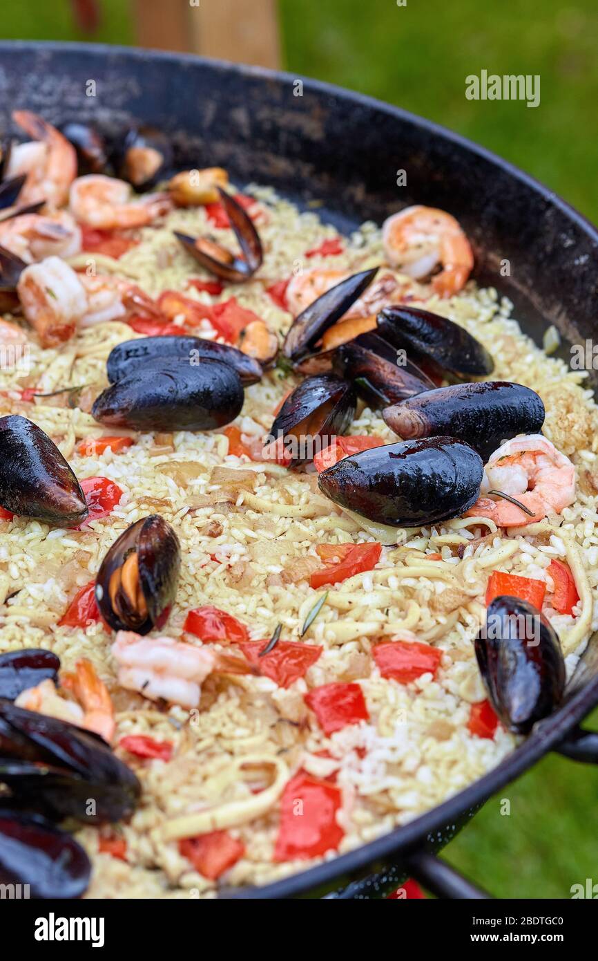 Paella traditional Spanish food. Paella with with mussels, king prawns ...