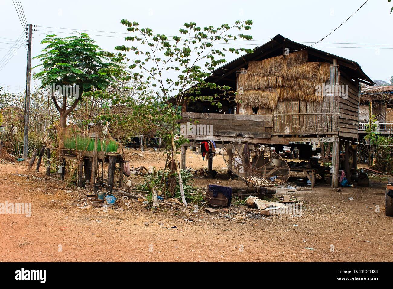 Traditional house on stilts in Laos Stock Photo - Alamy