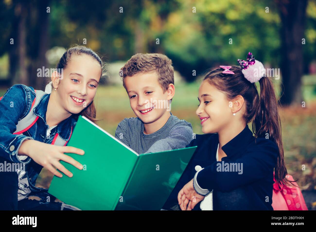 Back to school. Children with backpacks are having fun, talking ...