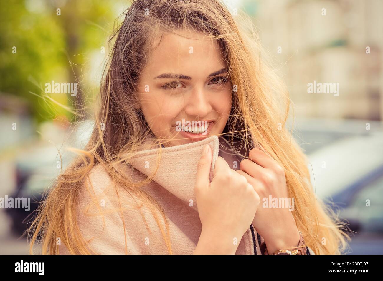 Windy. Woman happy hair on face. Closeup portrait beautiful smiling ...