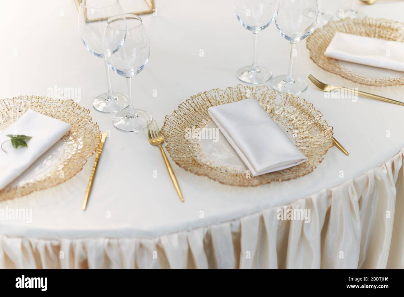 Beautiful table setting on soft beige color tablecloth. Ready to serve ...