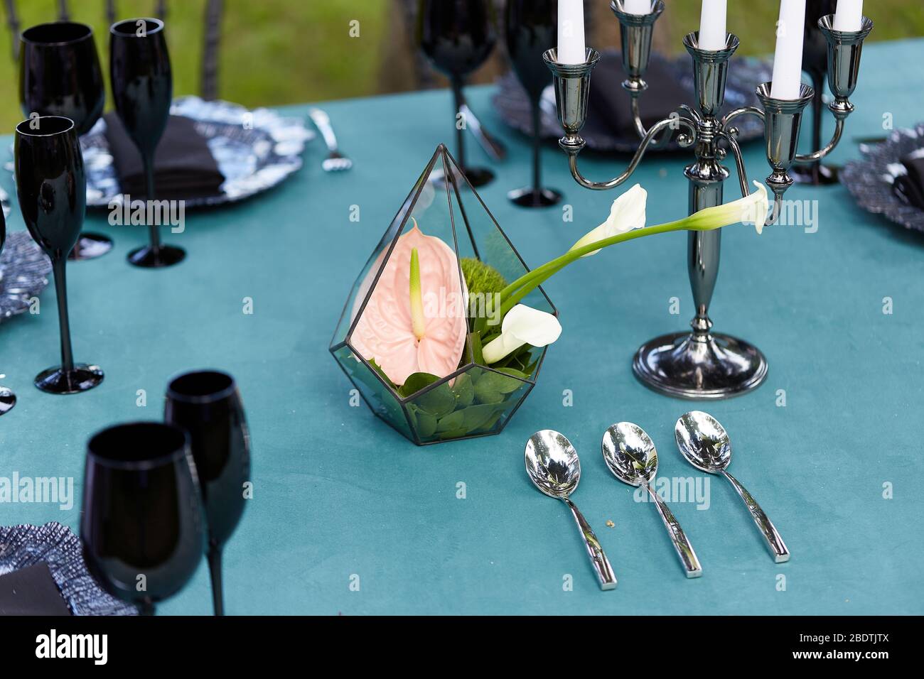 Beautiful table setting on sea blue tablecloth. Ready to serve lunch ...