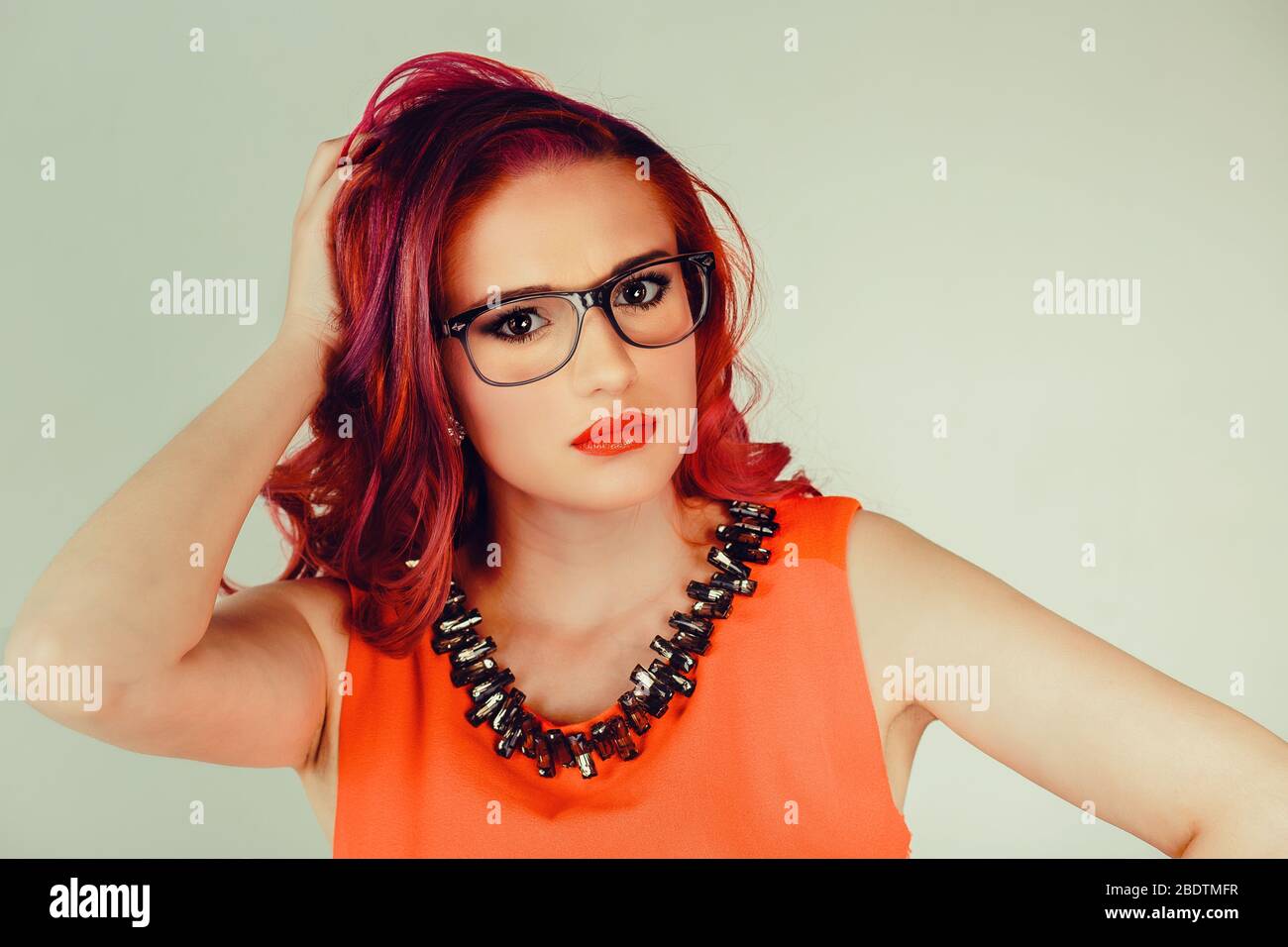 Puzzled woman. Portrait close up head shot of beautiful young female ...