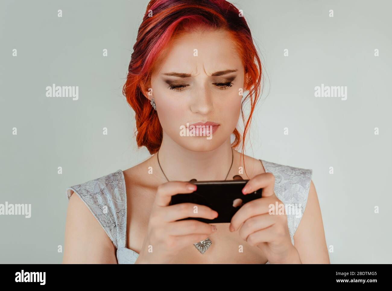 Upset woman texting. Closeup portrait of stressed woman holding ...