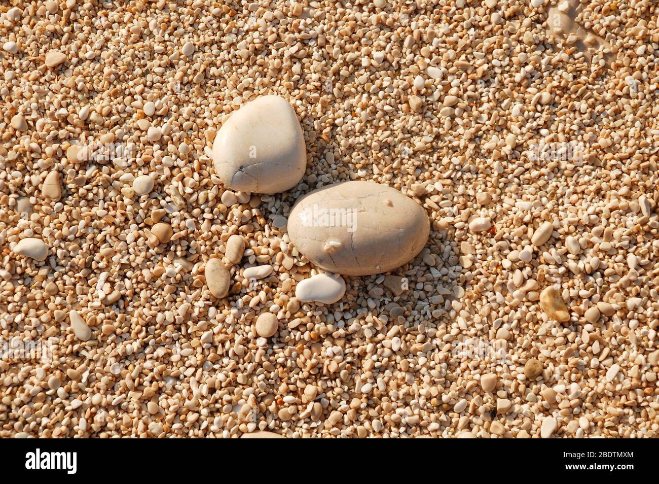 two stones in the sand Stock Photo - Alamy