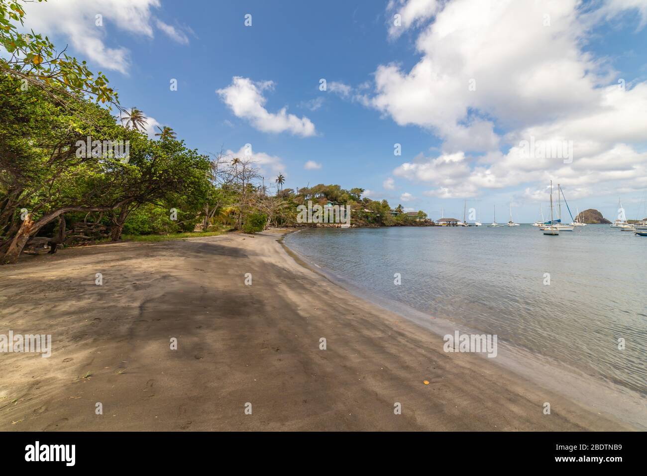 Saint Vincent and the Grenadines, black sand beach in Blue Lagoon Stock ...
