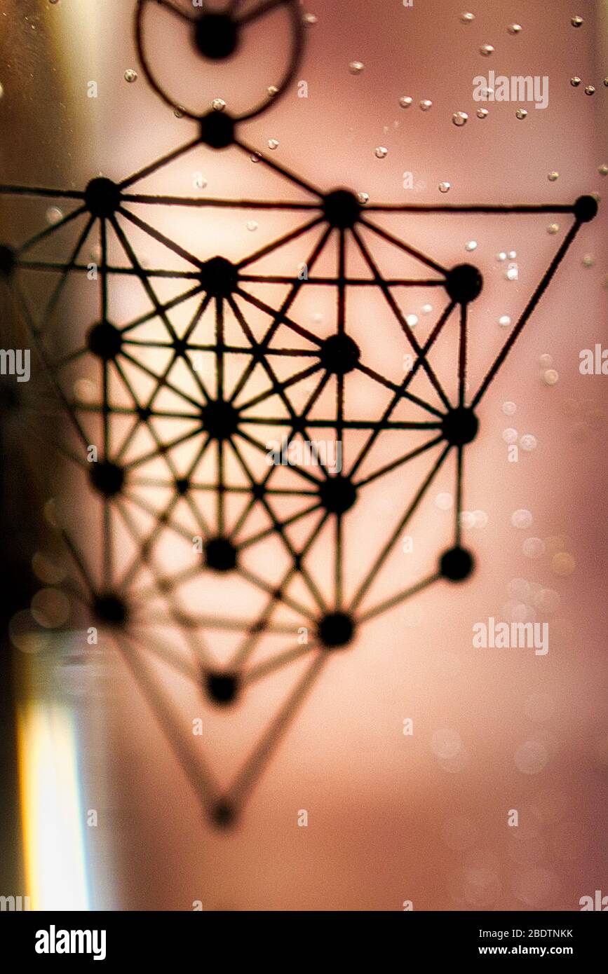 Sacred Geometry Symbol on a Water Bottle with a Rose Quartz Crystal ...