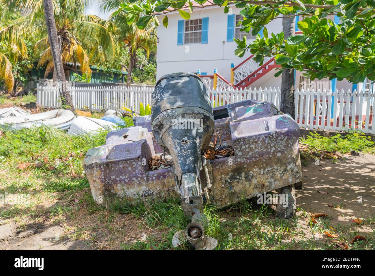 Fishing boat with barnacle encrusted outboard engine in Canash beach ...