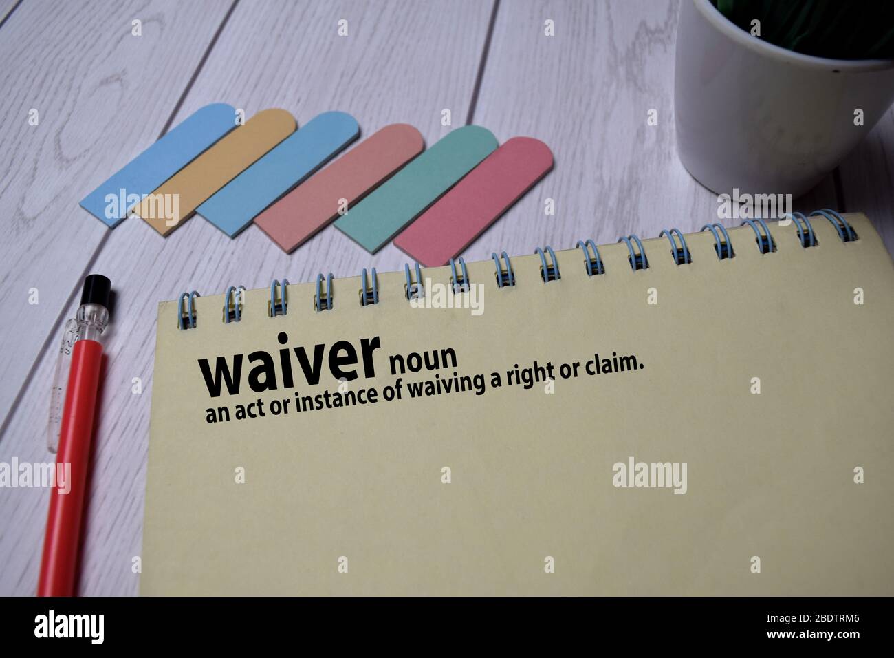 Definition of Waiver word with a meaning on a book. dictionary concept ...
