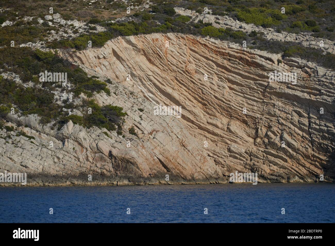 Beautiful high cliff with caves and hanging rocks of a mountain in ...