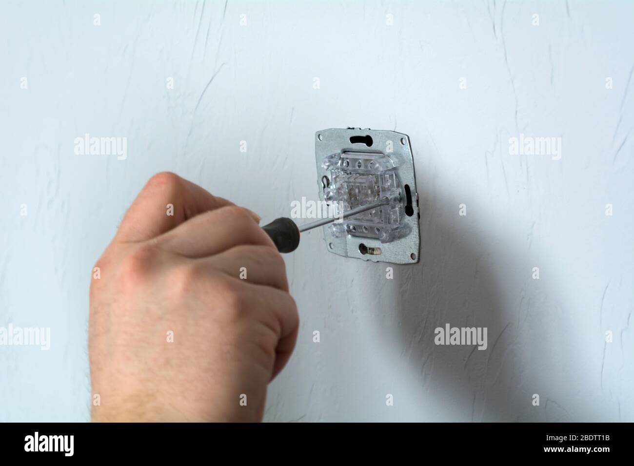 Socket plug installation. Disassembled electrical outlet in detonation ...