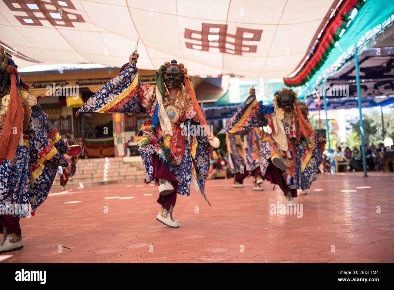 Cham dance performed with masks by Tibetan monks during Losar (Tibetan ...
