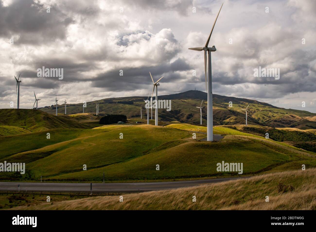 A wind farm and turbines generating electricity on the top of the hills ...