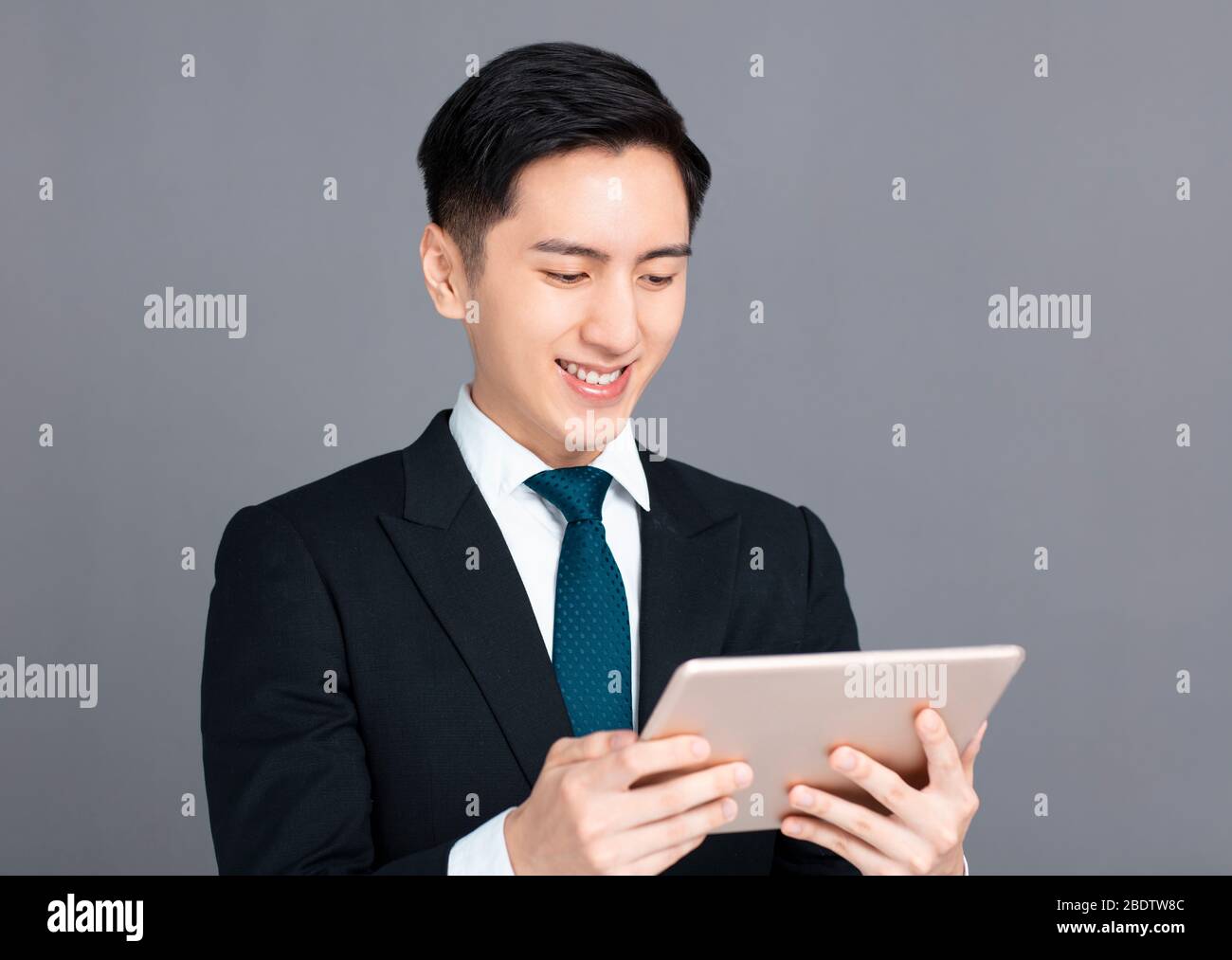 Portrait attractive young businessman using hi-res stock photography ...