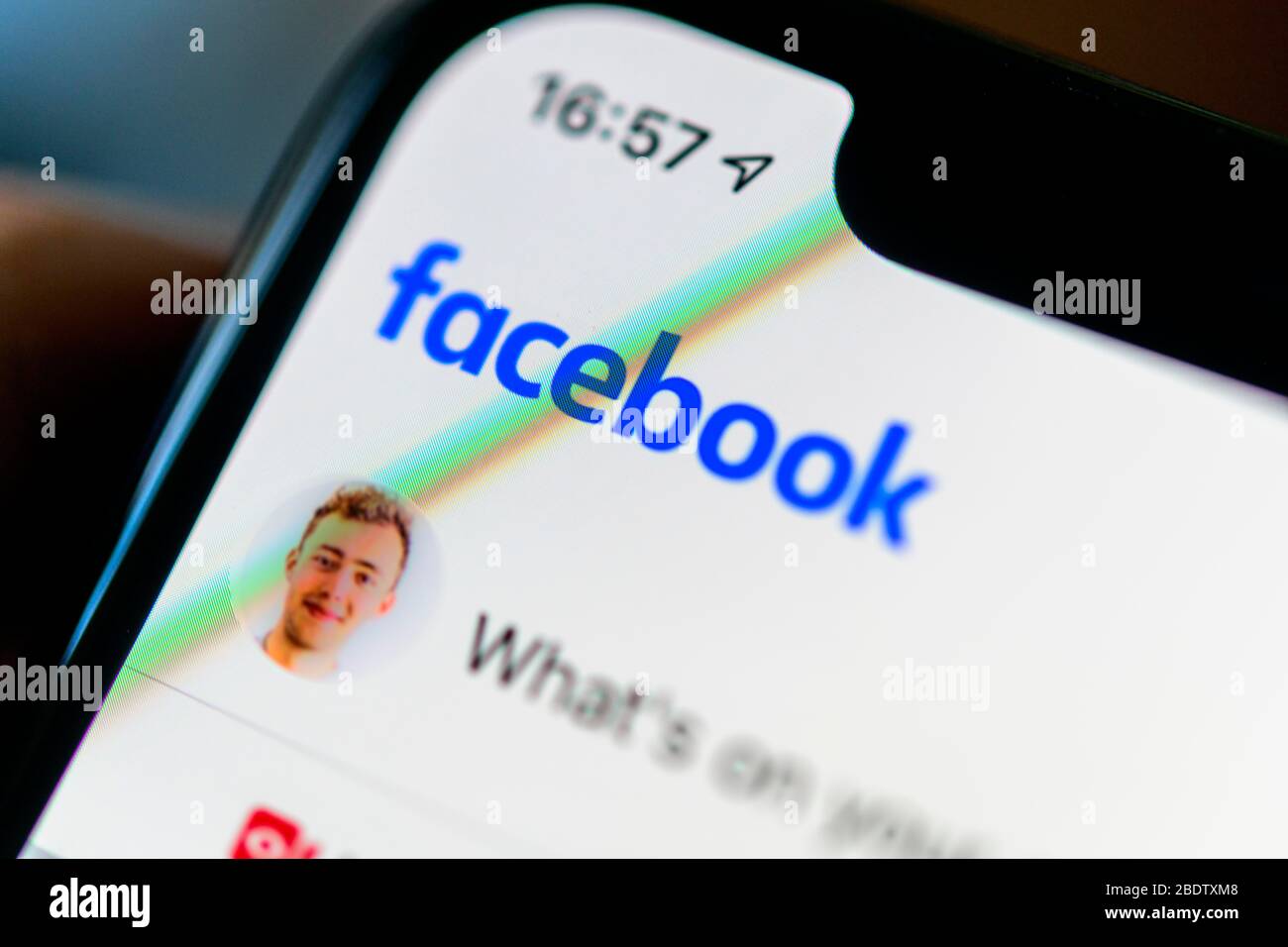 IPhone with open Facebook app, social network, app icon, display on ...