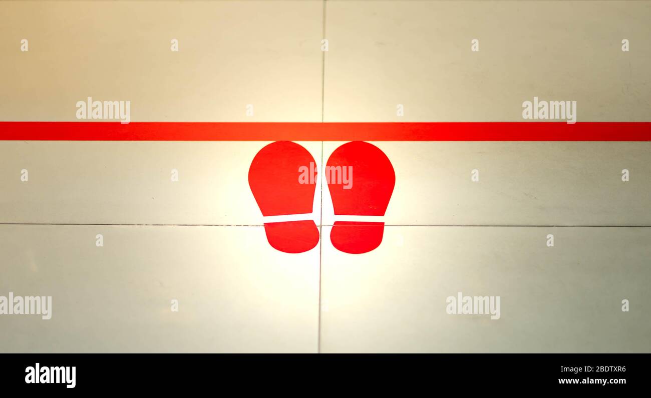 Social Distancing for footprint on the floor to sign for standing ...