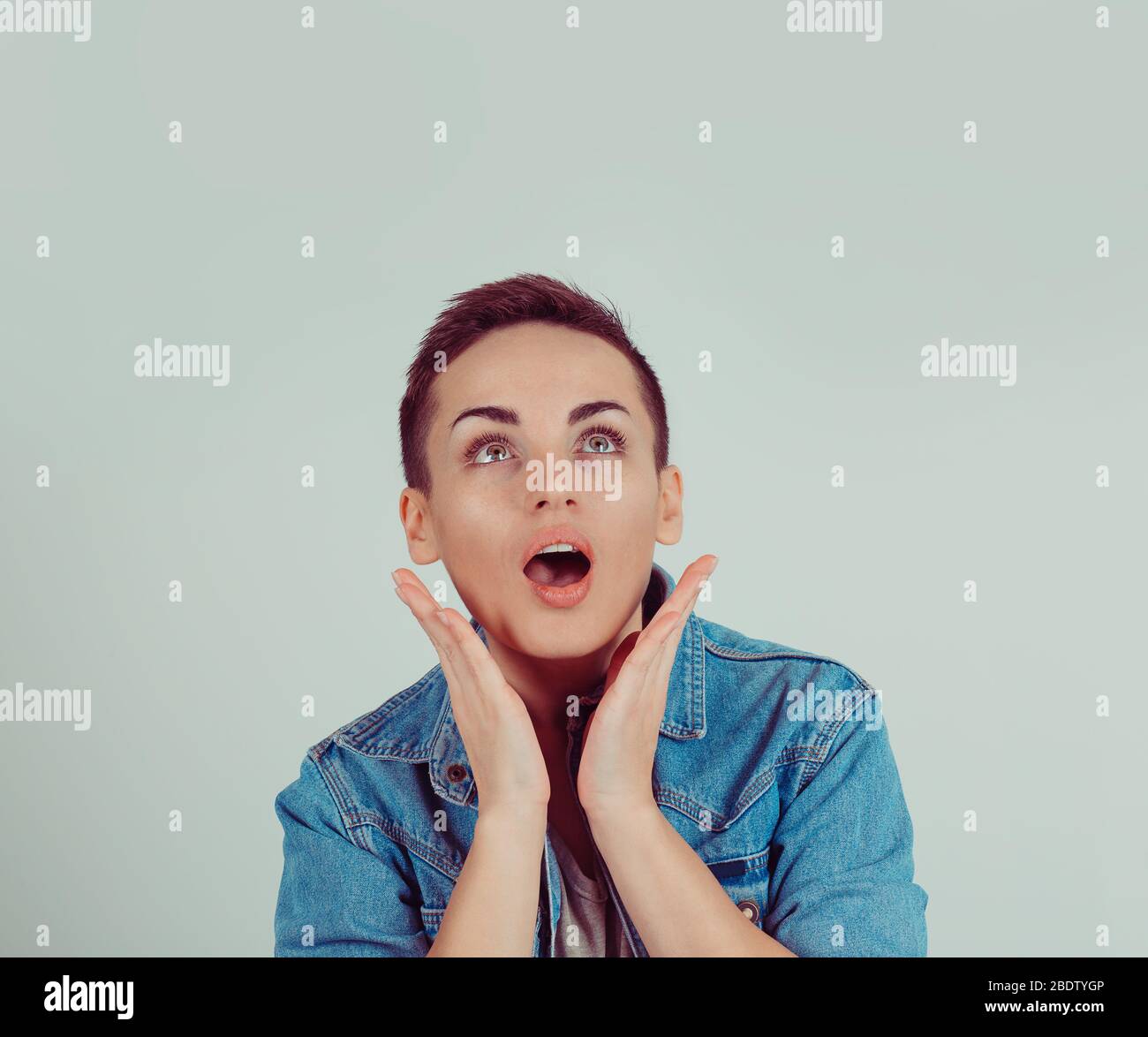 Astonished startled woman face hi-res stock photography and images - Alamy