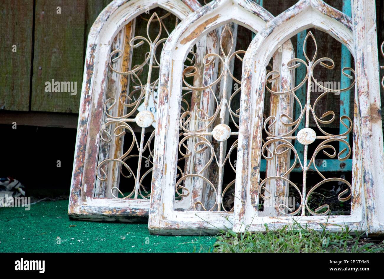 Decorative, arched wooden windows at a salvage yard Stock Photo - Alamy