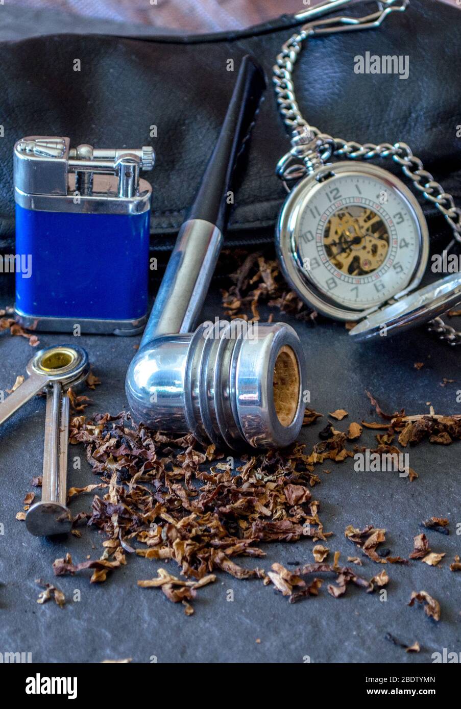 Aristicob pipe still life with a pipe tool, flint lighter and pocket ...