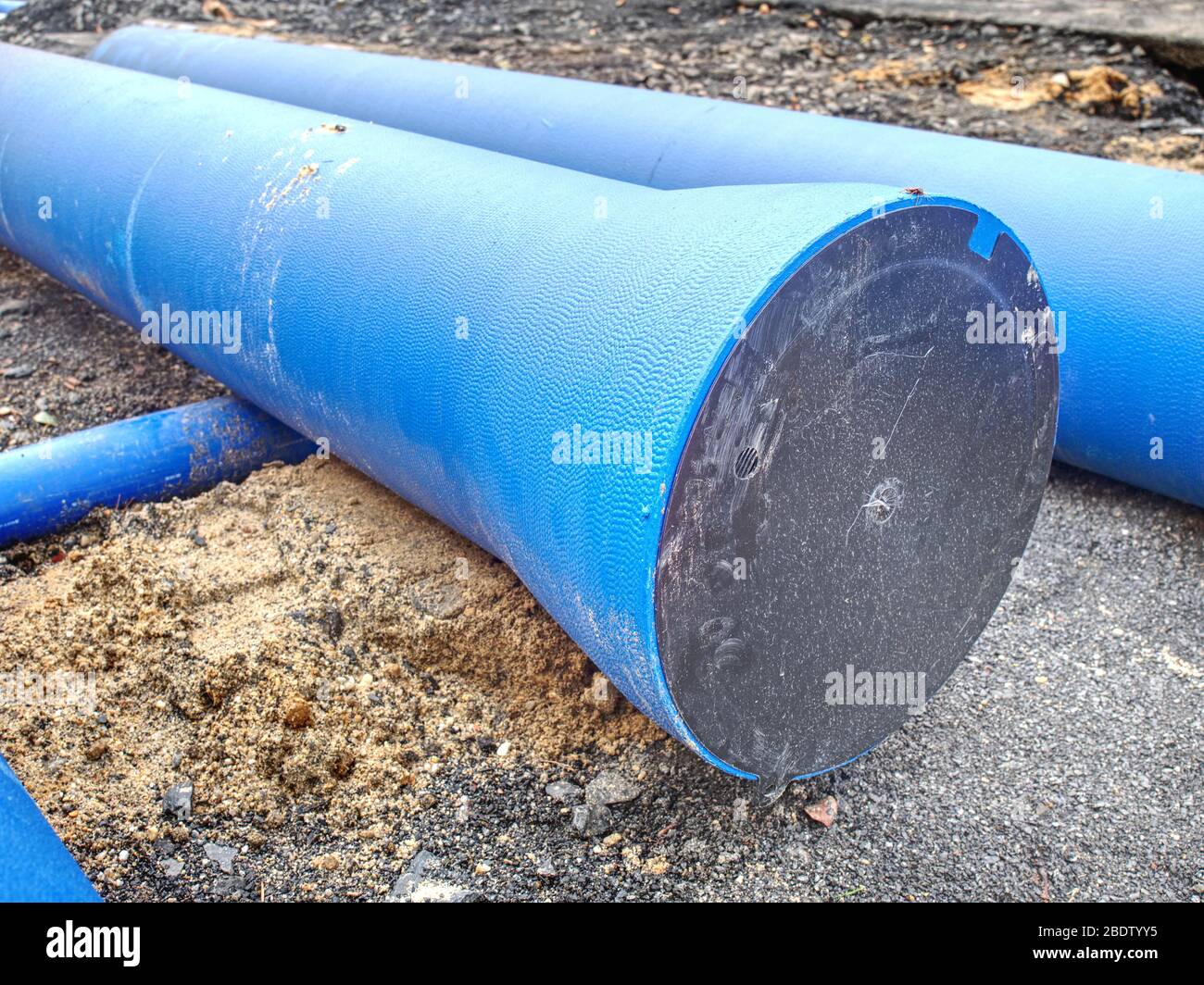 Pipes on building site ready for using underground. New pipeline for ...