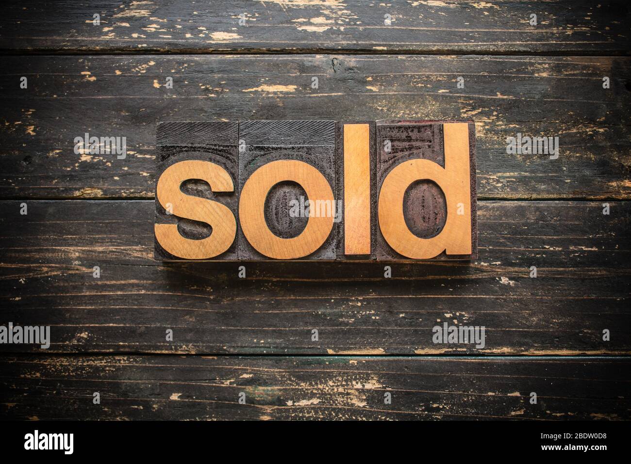 The word "SOLD" written in vintage wood letterpress type on a vintage ...