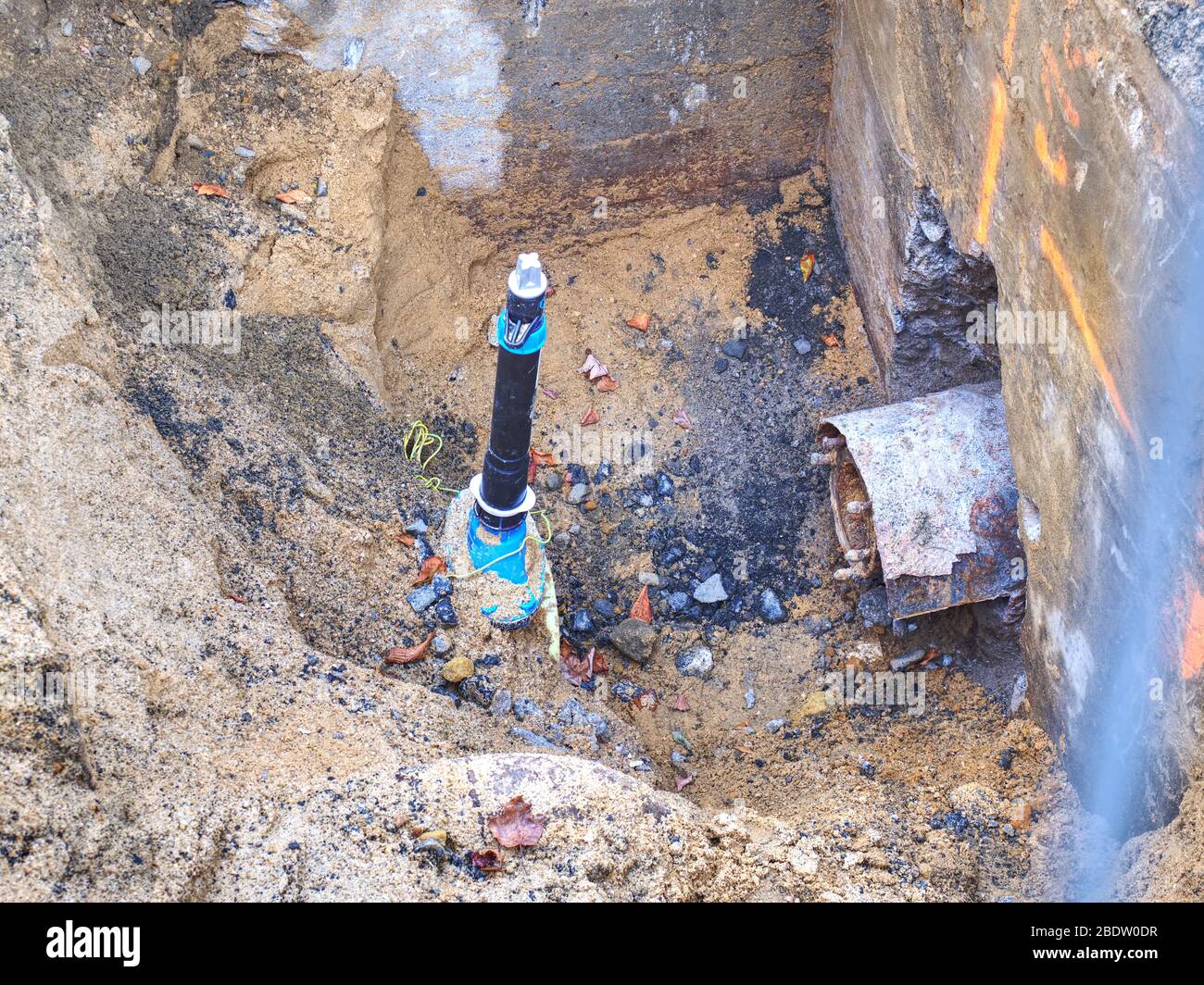 Building site in front of flat house. Repairing of water supply ...