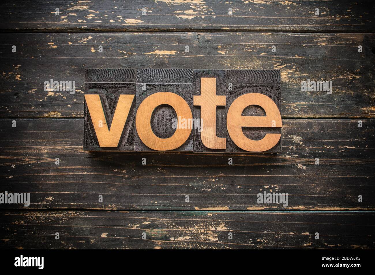 The word "VOTE" written in vintage wood letterpress type on a vintage ...