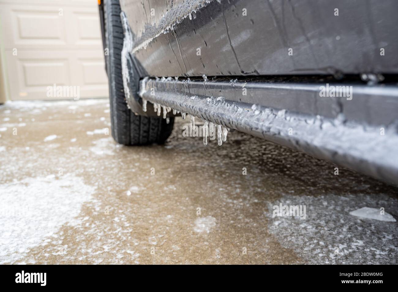 Freezing rain caused buildup of ice on concrete pavement and side ...