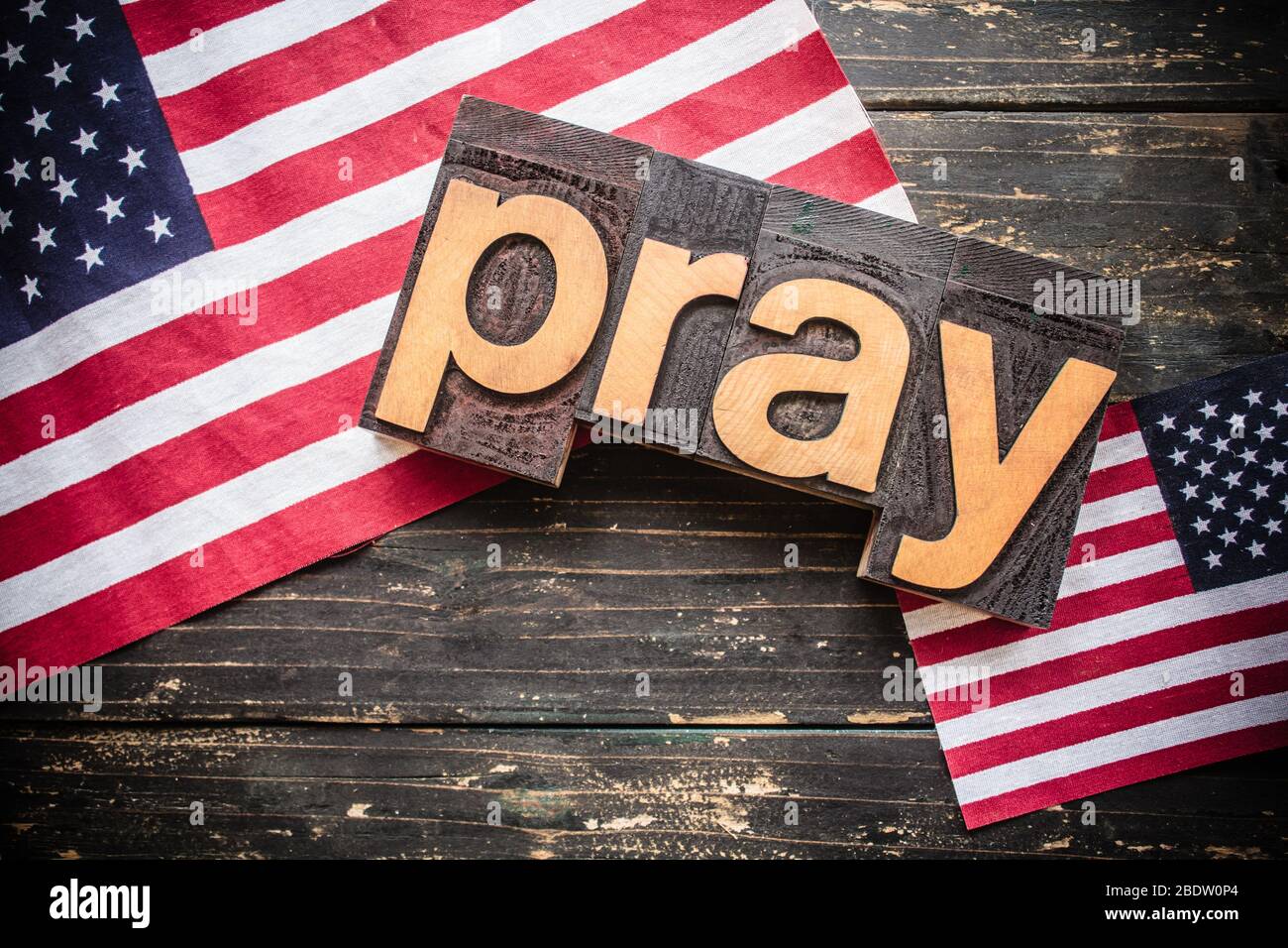 The word "PRAY" written in vintage wood letterpress type on a vintage ...