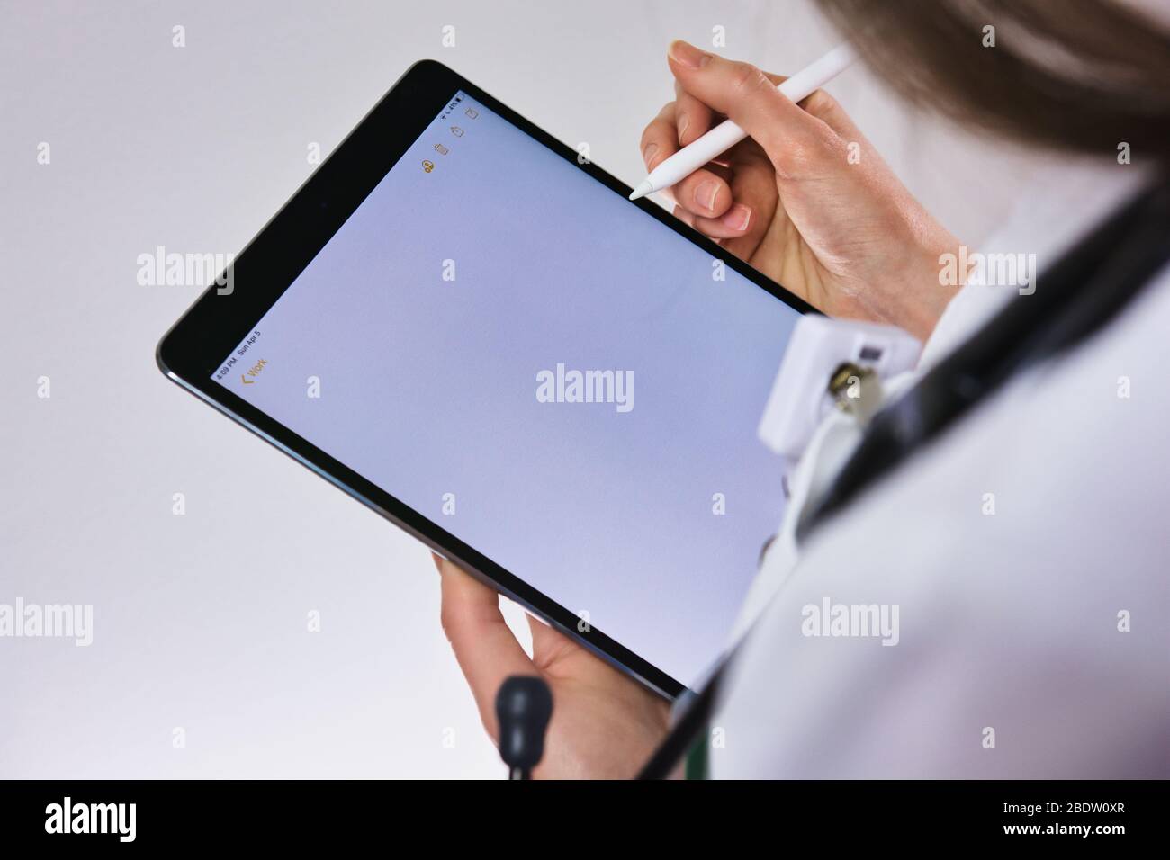 Healthcare worker using tablet to conduct healthcare. doctor or nurse ...