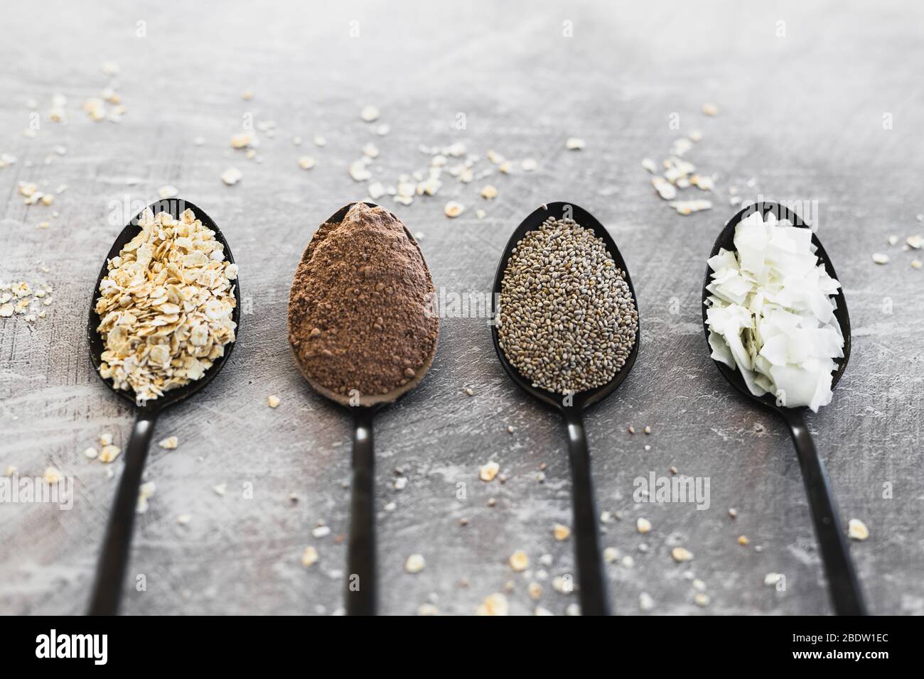 food ingredients for a healthy plant-based diet, spoons lined up on ...