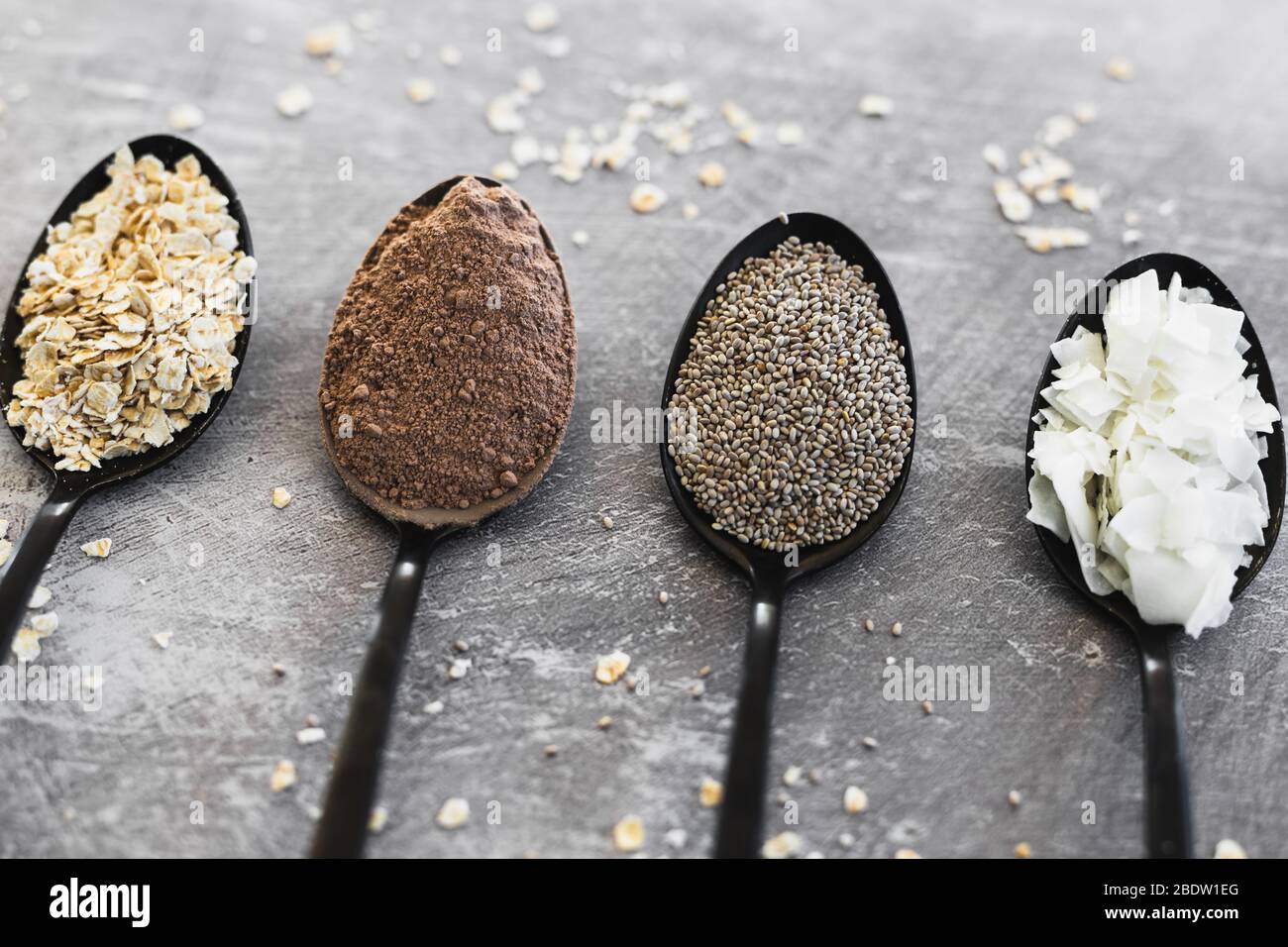 food ingredients for a healthy plant-based diet, spoons lined up on ...