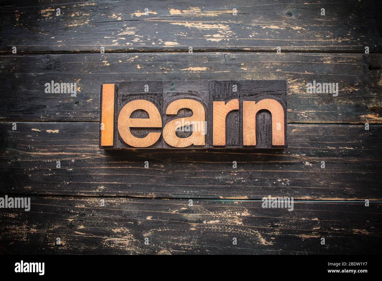 The word "LEARN" written in vintage wood letterpress type on a vintage ...
