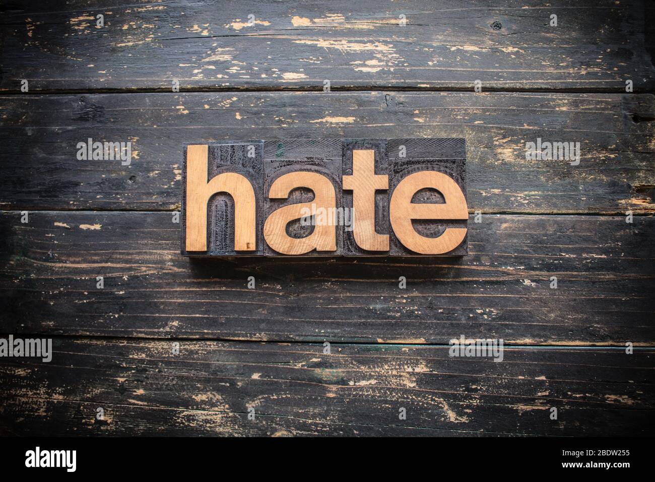 The word "HATE" written in vintage wood letterpress type on a vintage ...