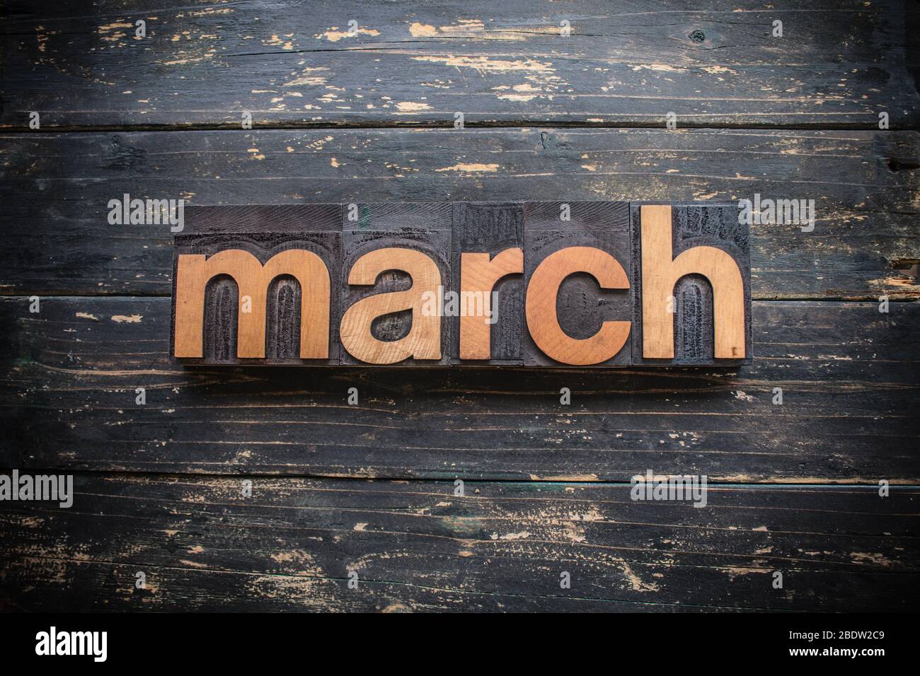 The word "MARCH" written in vintage wood letterpress type on a vintage ...