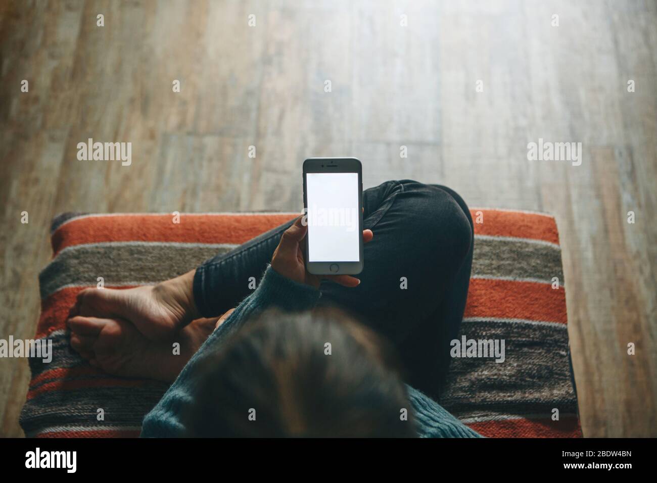 Girl at home uses a cell phone or mobile phone mockup. Modern ...