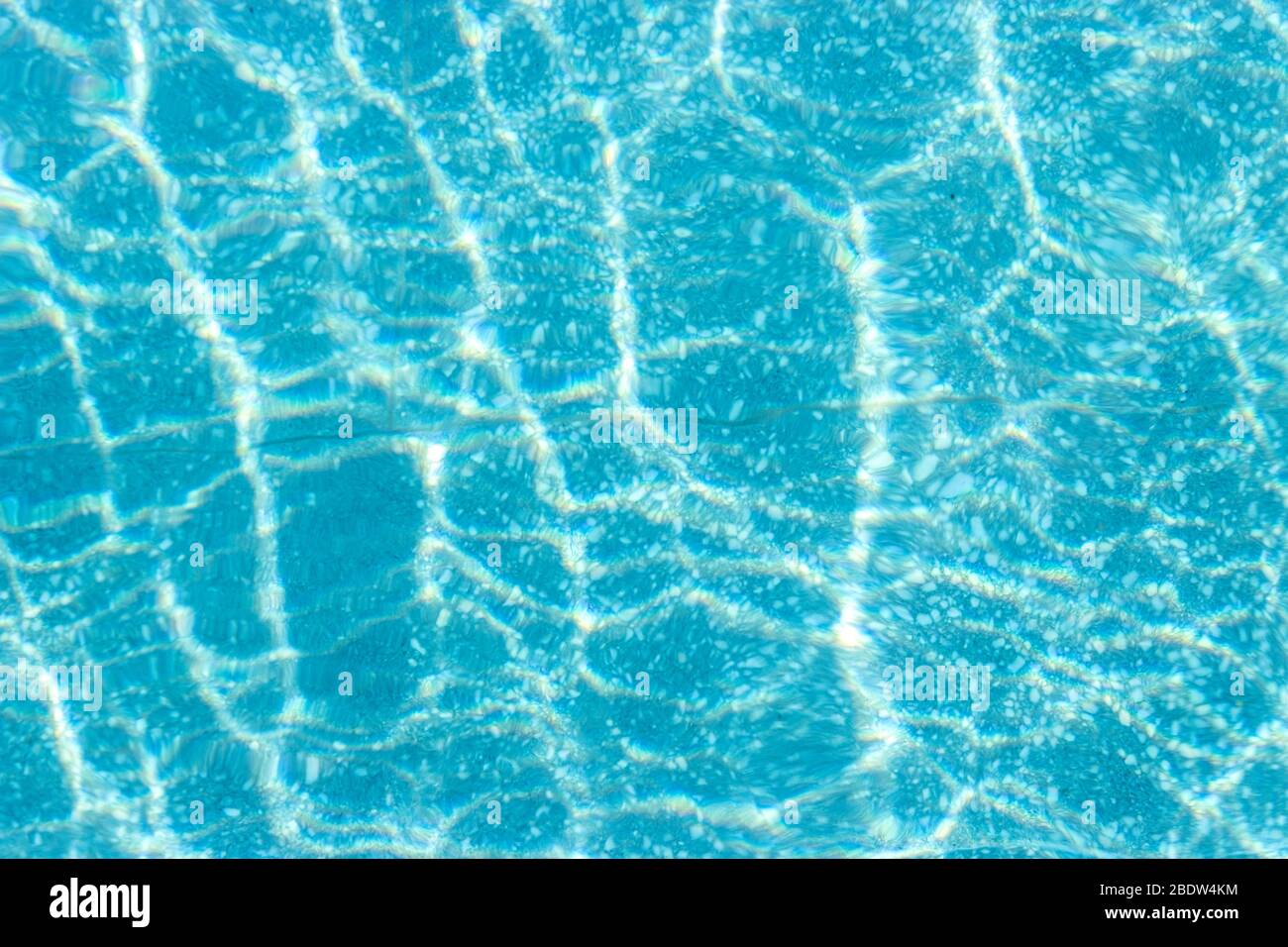 Abstract top view blue ripple swimming pool water and sun reflection ...