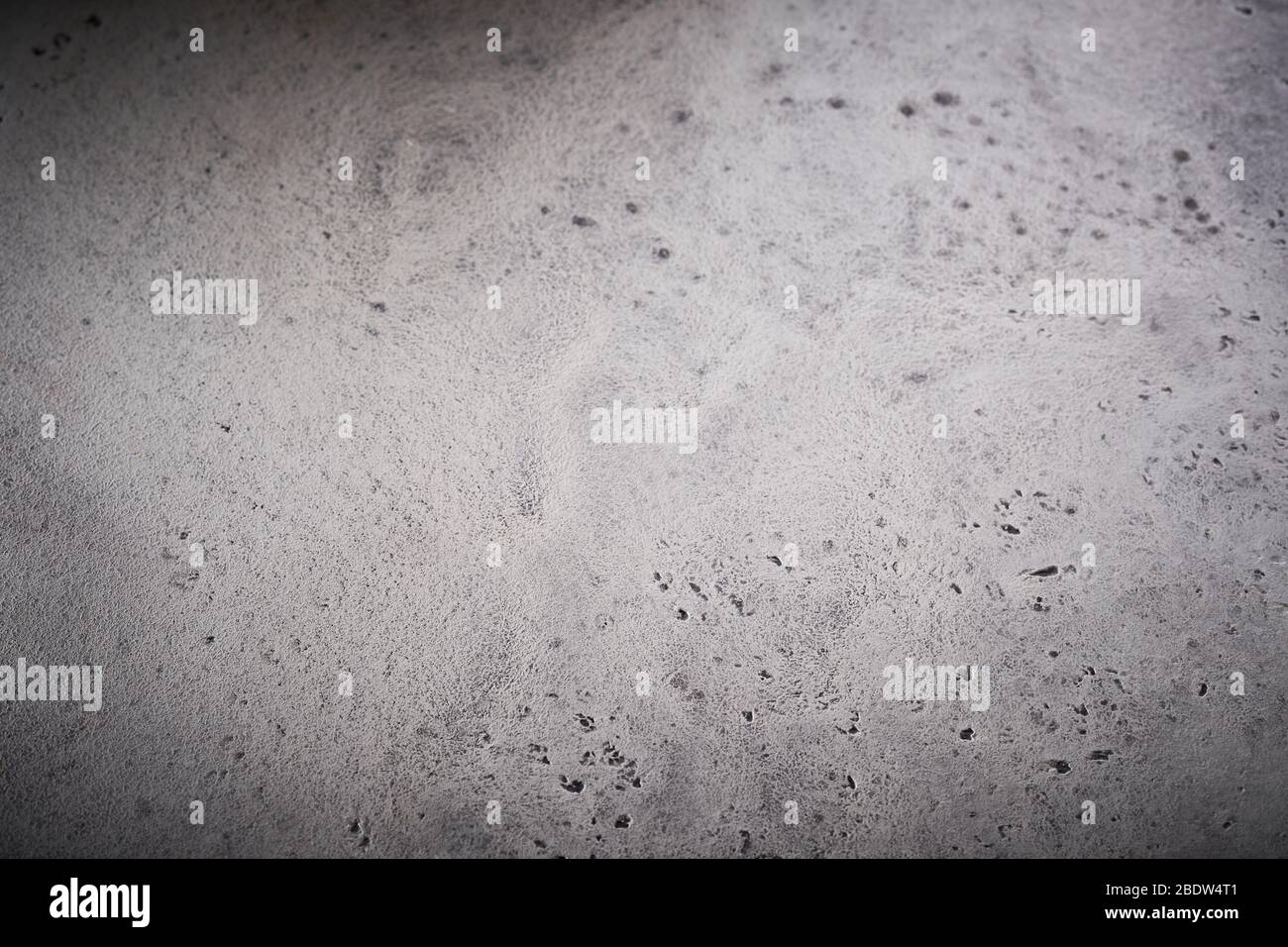 A close up of plain, grey concrete surface showing aggregate Stock ...