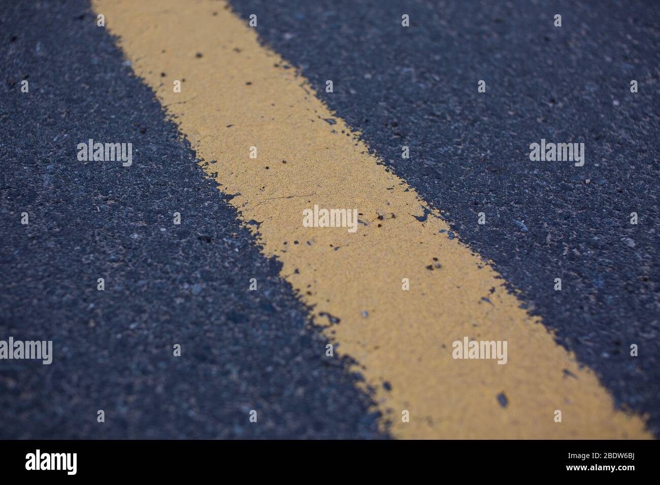 view of asphalt with distinct two yellow stripes Stock Photo - Alamy