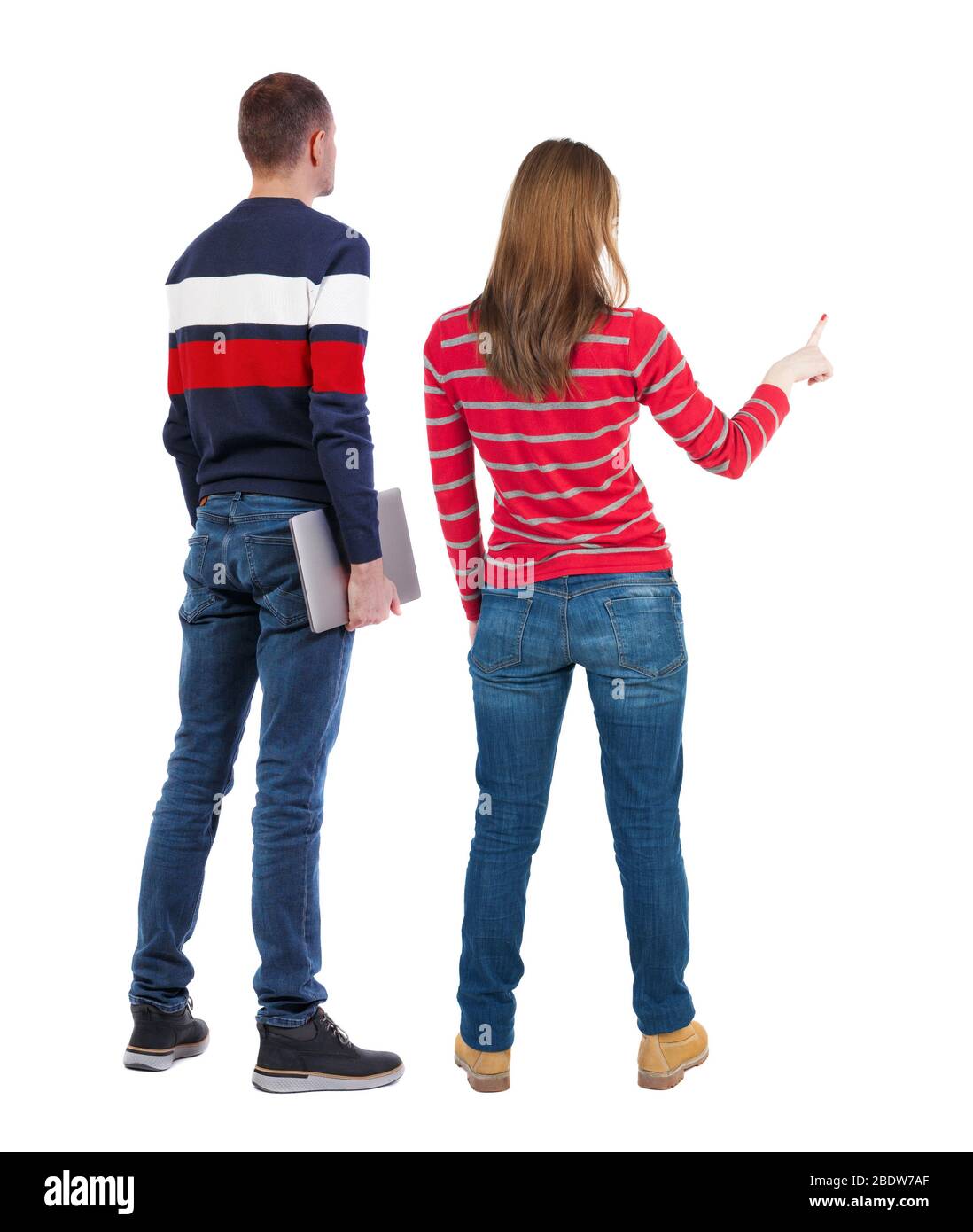 Back view couple with laptop in sweater. beautiful man and woman. Rear ...