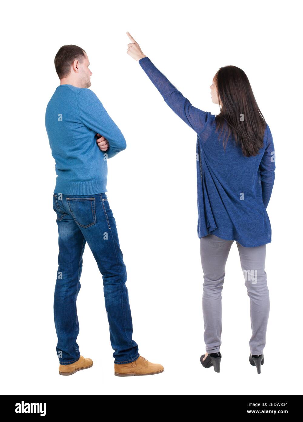 Back view of couple in sweater pointing. Rear view people collection ...