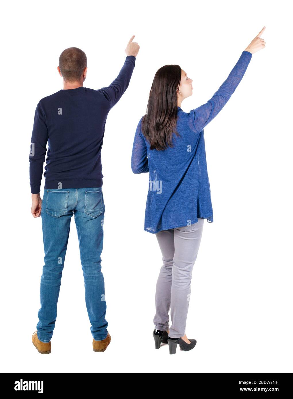 Back view of couple in sweater pointing. Rear view people collection ...