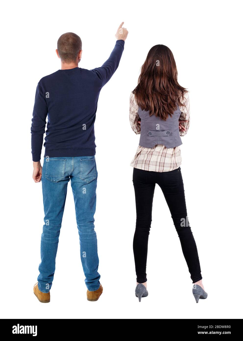 Back view of couple in sweater pointing. Rear view people collection ...