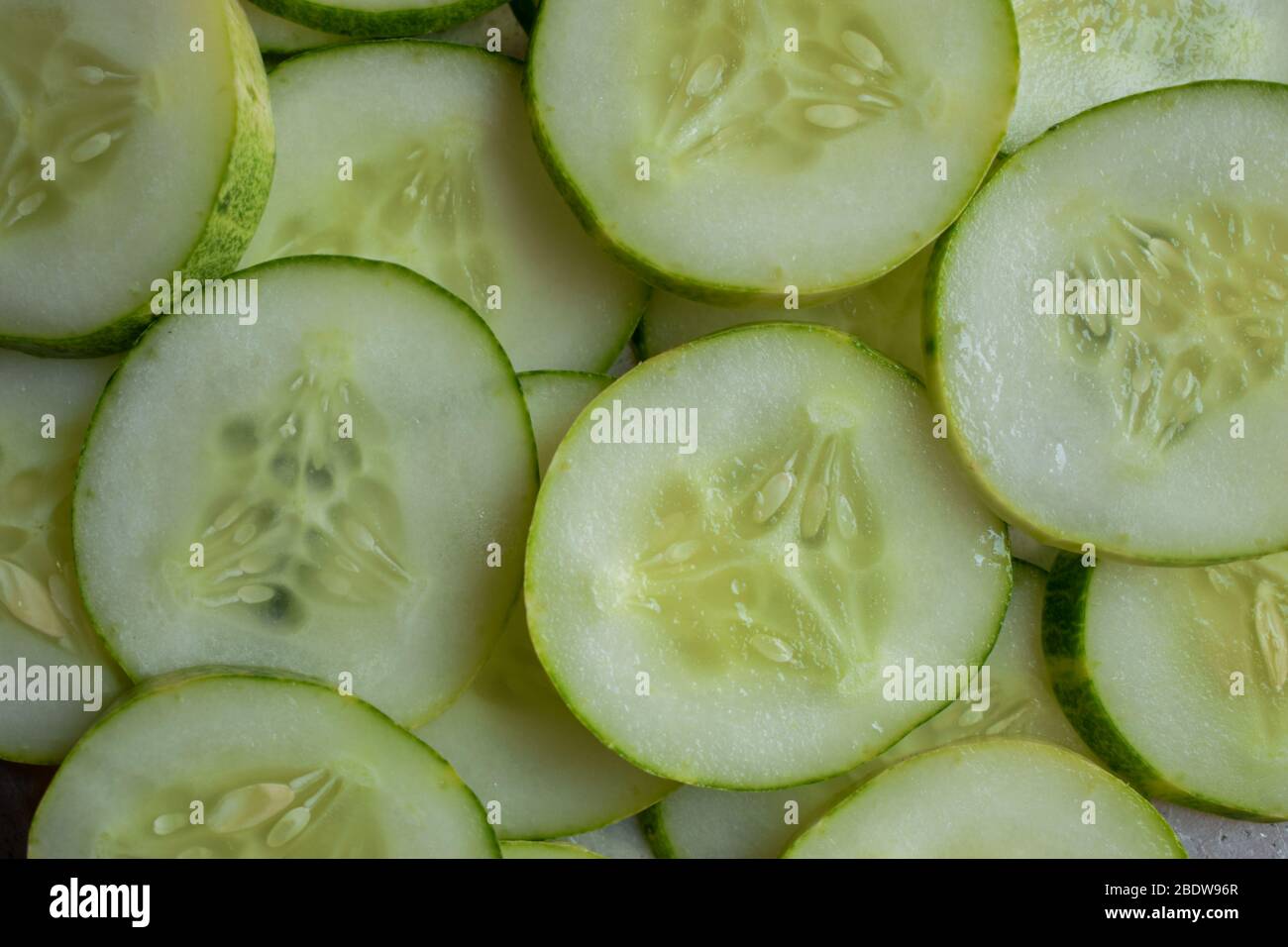 Fresh Cucumber Round Circle Slices As Whole background Texture Stock ...