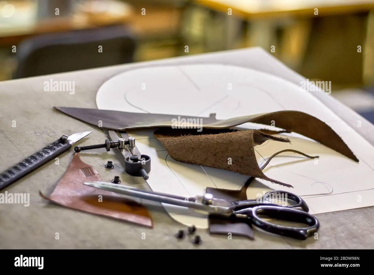 Leather crafting DIY tools and templates on workbench. Fittings and ...