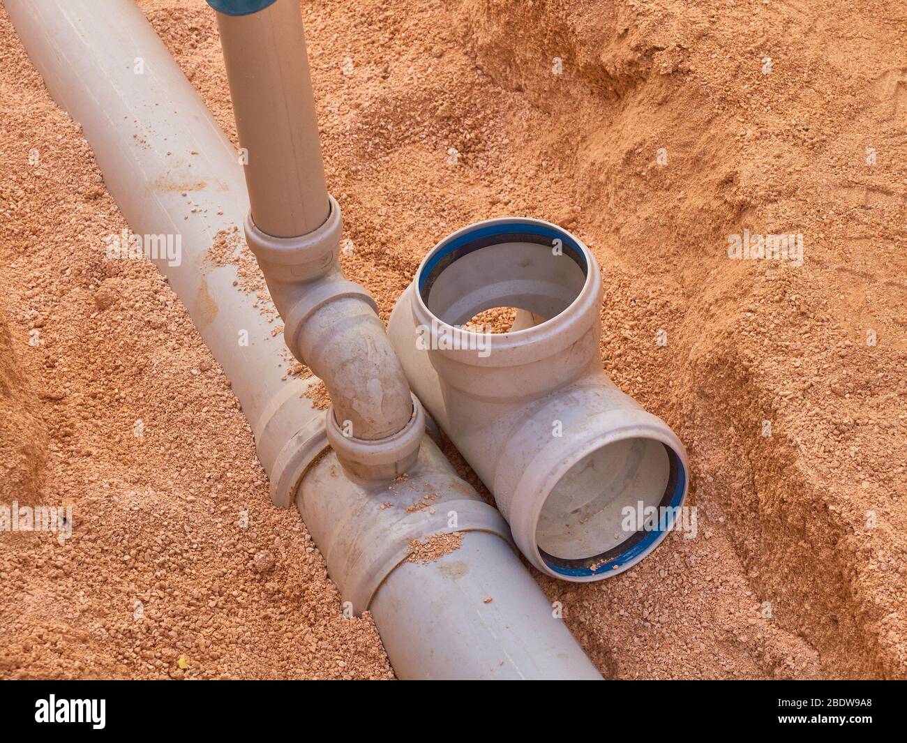 Junction of plastic sewer pipes. Sewage pipeline system of residential ...