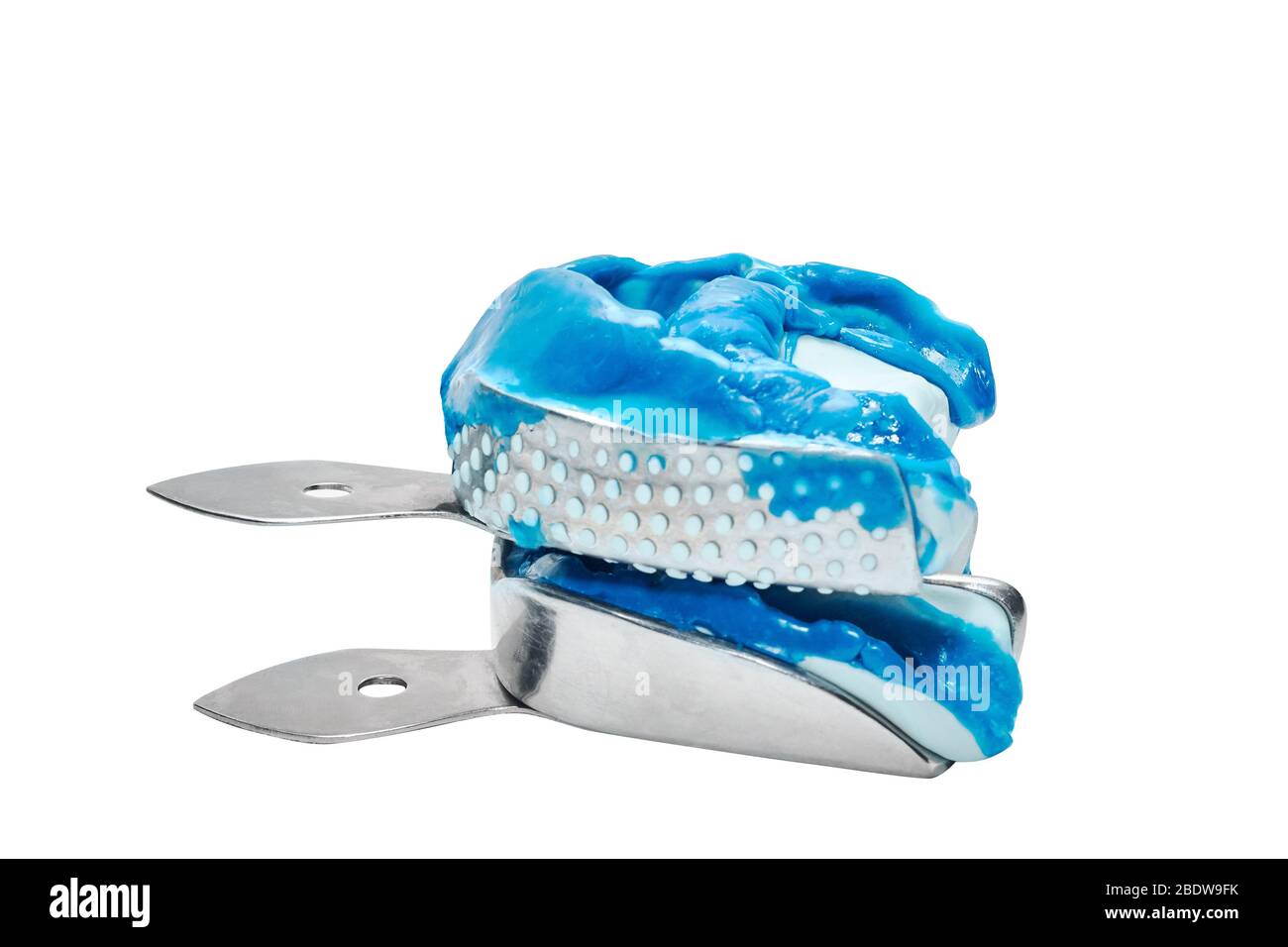 Two dental impressions on a blue background with copy space. Dental ...