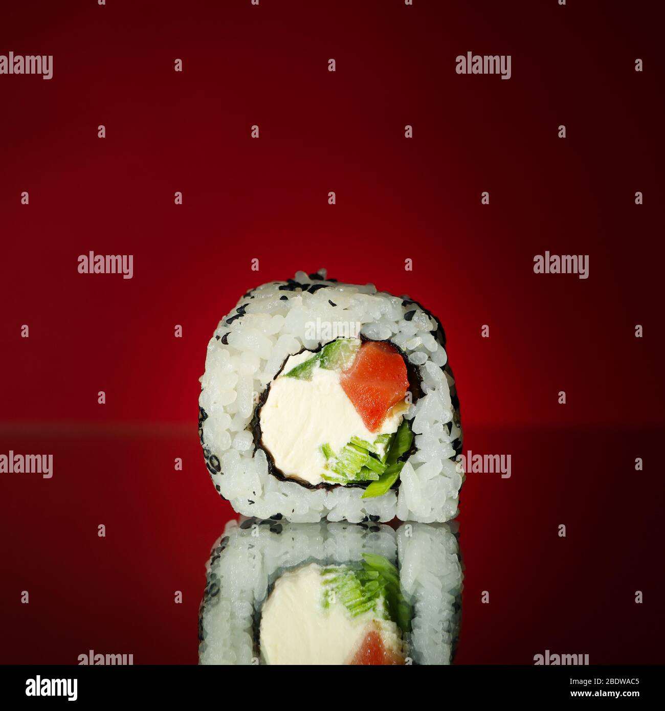 Delicious sushi roll on mirror background, close up. Japanese food ...