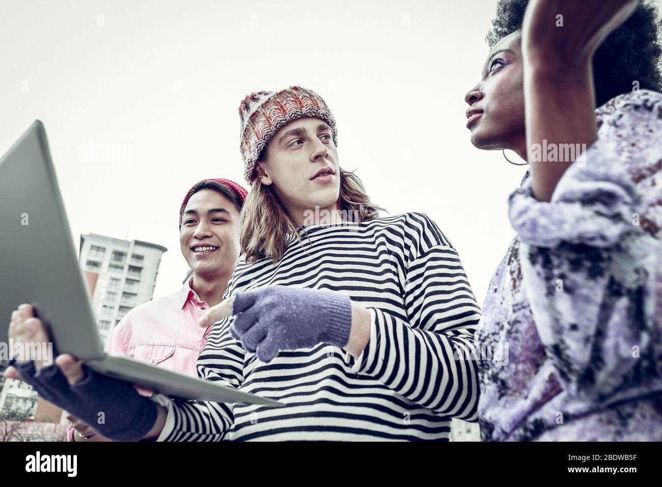 Attentive longhaired man listening to his friend Stock Photo - Alamy